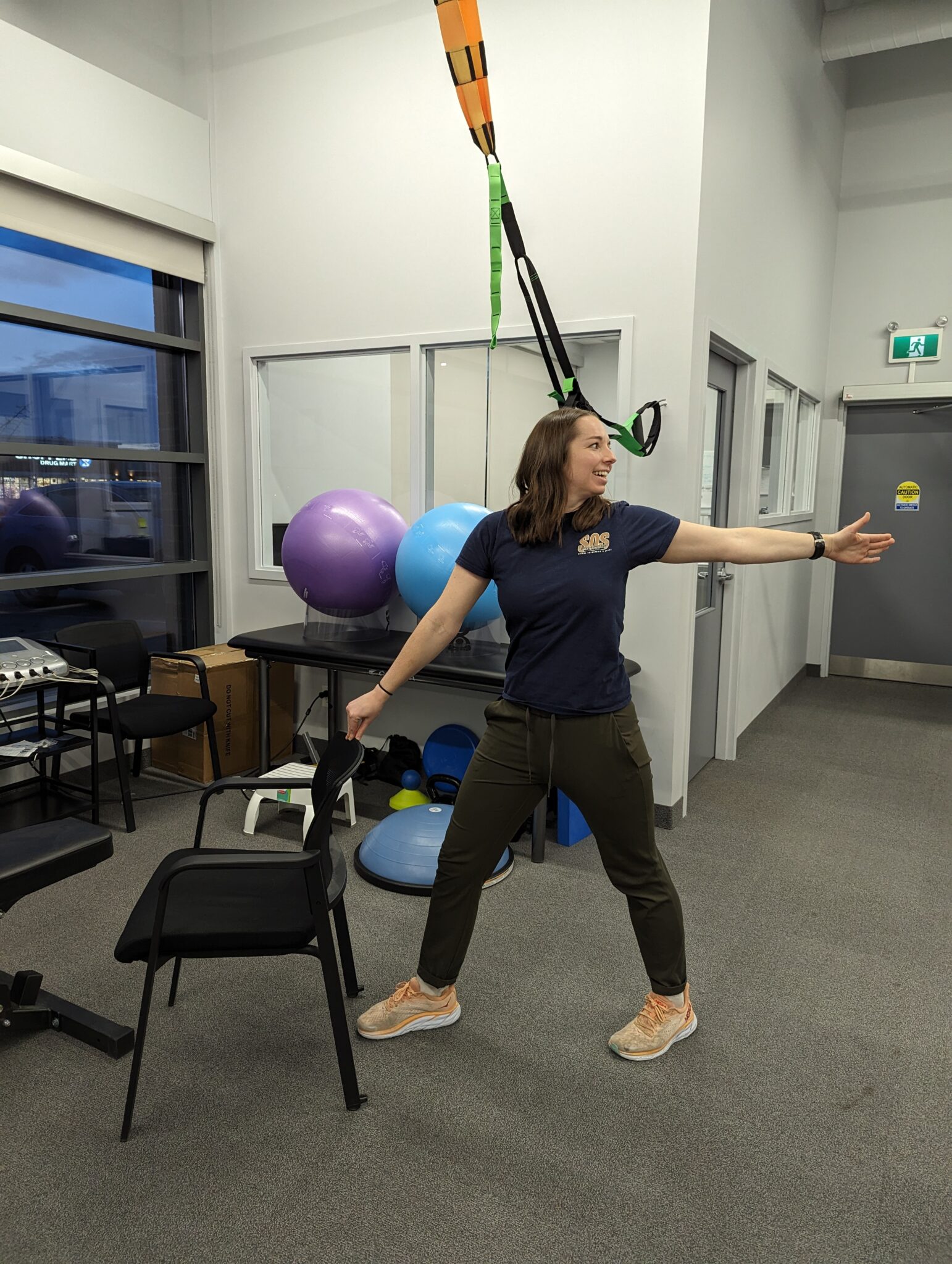 Standing Back Stretch - SOS Physiotherapy